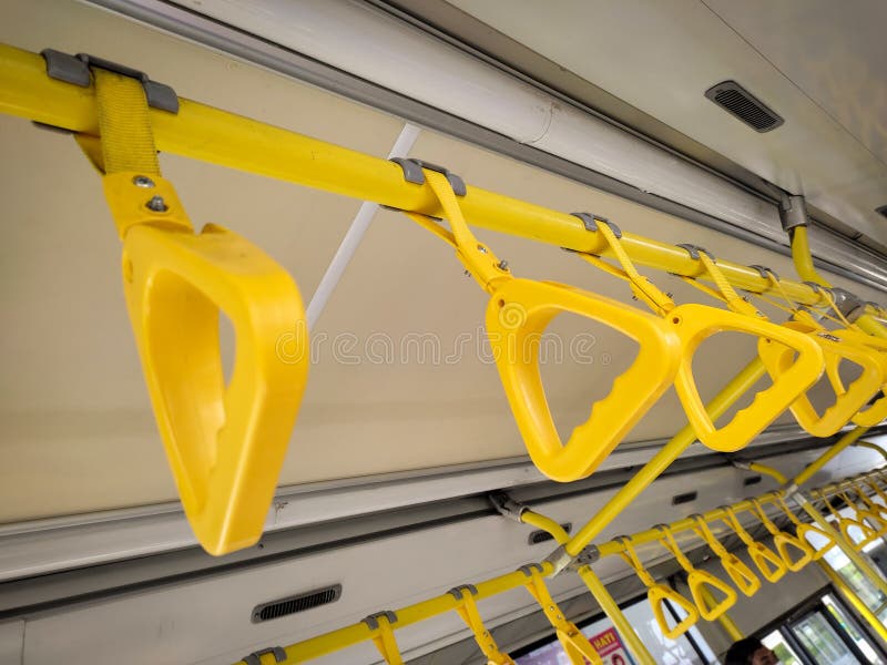 Hanged Yellow Triangle Handle Inside of a Bus Stock Image - Image of ...