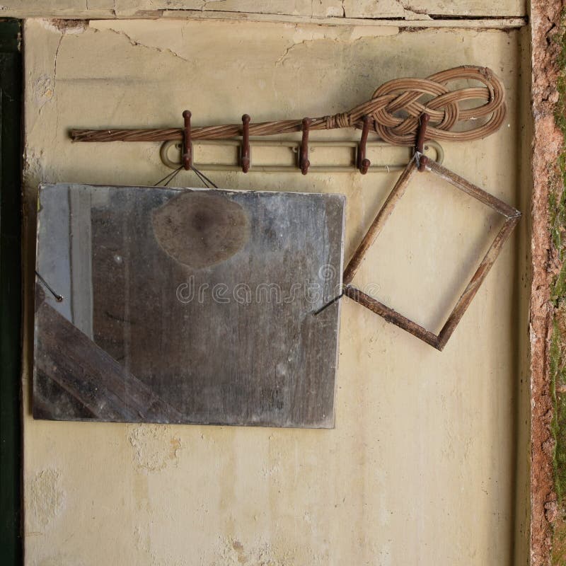 Hanger with Rusty Mirror and Broken Frame Stock Photo - Image of empty ...