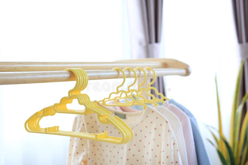 Hangers with Clothes Hang on a Wood Rack in House Stock Image - Image ...