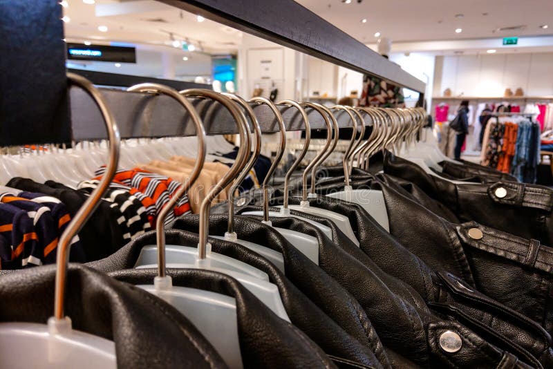 Hangers with Clothes in a Row in the Store. Things on Hangers Stock ...
