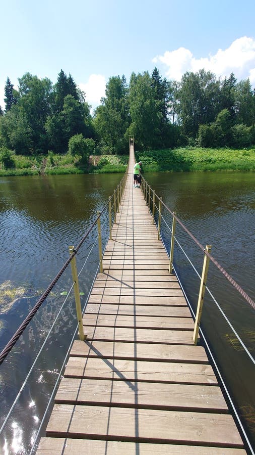 Simple Suspension Footbridge Over Mountain Valley Stock Photo - Image ...