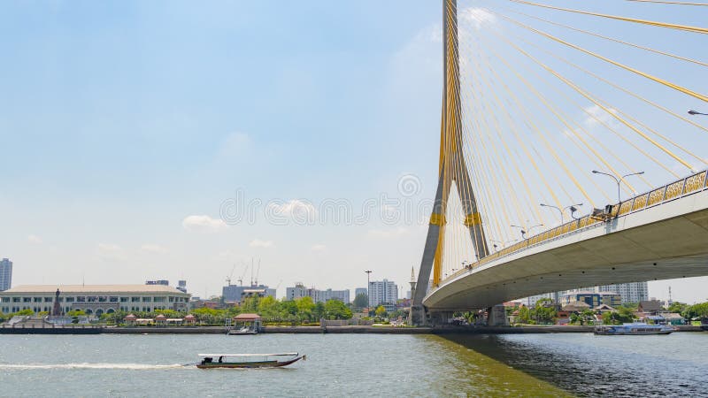 Hanging Bridge Structure Cross the River with Speed Boat and Cit ...