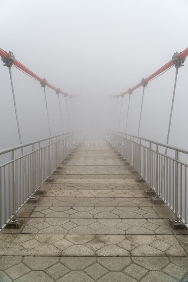 Hanging Bridge Vanishing in Fog Stock Image - Image of long, mist ...