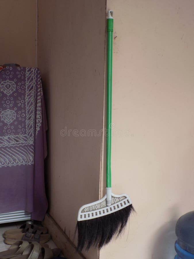 A hanging broom stock image. Image of home, clean, interior - 224684435