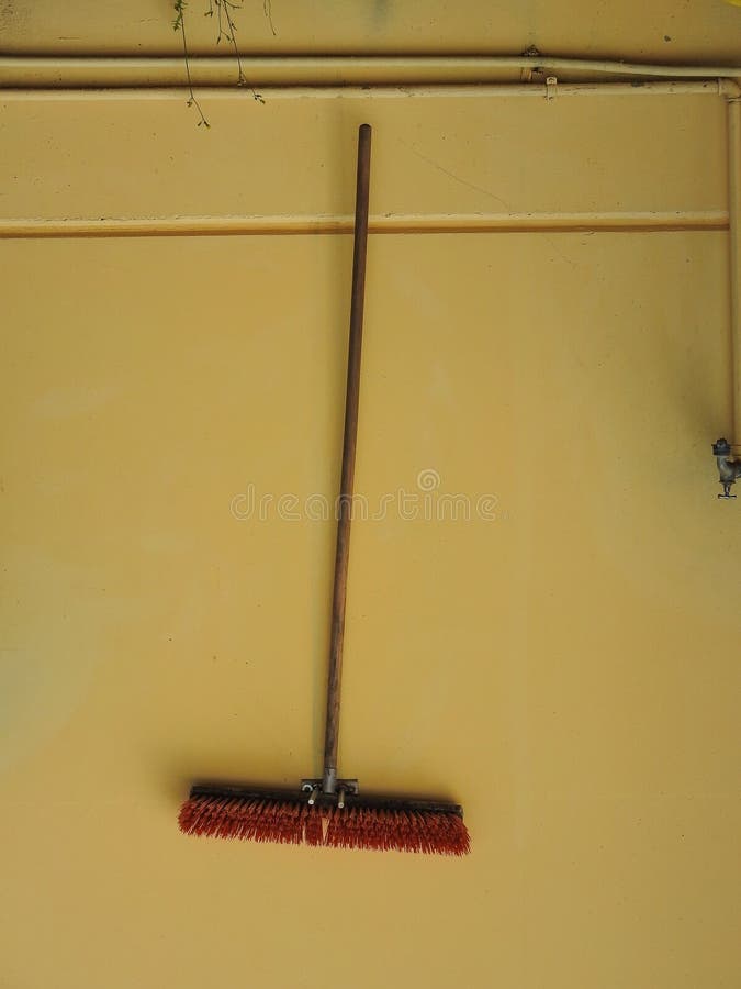 Hanging broom on the wall stock photo. Image of people - 123622868