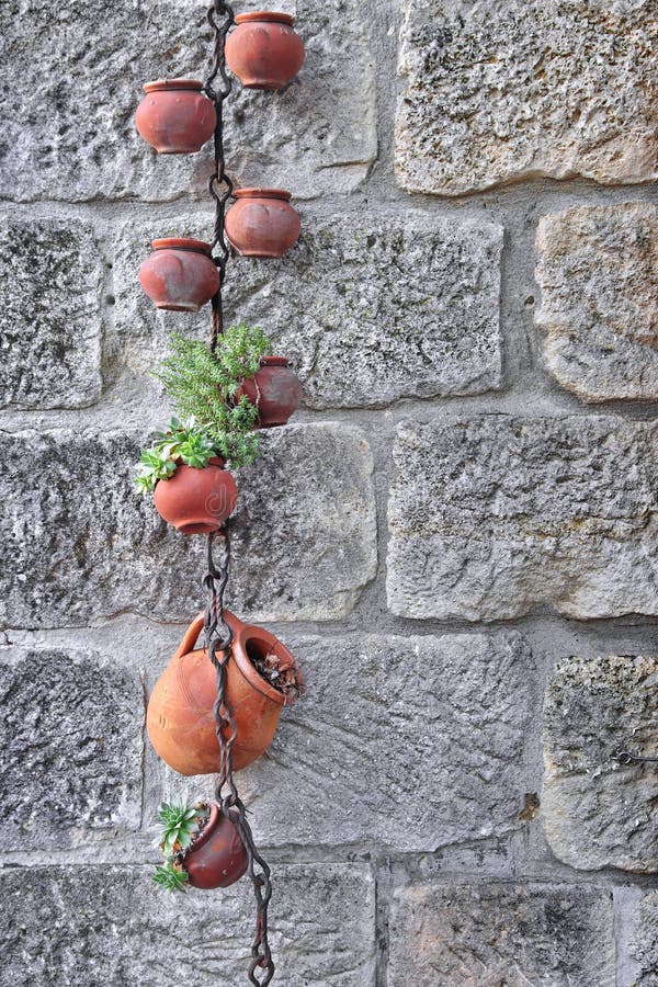 Hanging clay pots stock photo. Image of cotta, purple - 39310602