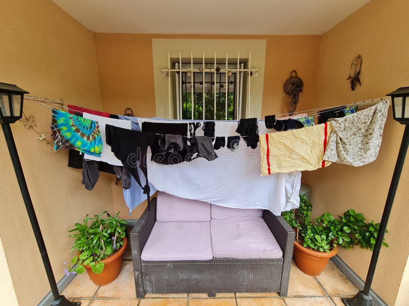 Hanging Clothes. House and Clothes Stock Photo - Image of floor ...