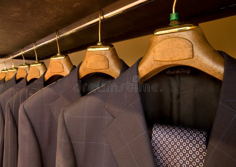 Hanging designer suits stock image. Image of dressed - 14135843