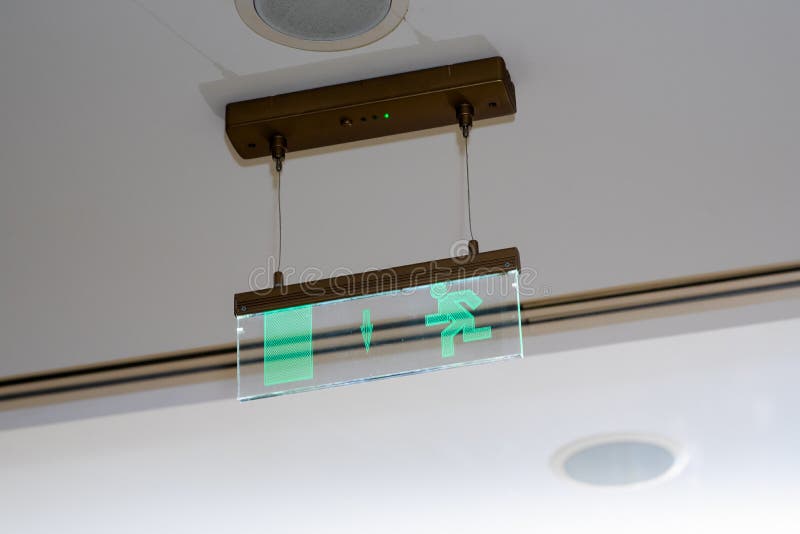 Hanging exit sign stock photo. Image of green, electrical - 129691604
