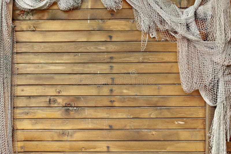 Hanging Fishnet on Wood Wall Stock Image - Image of panel, restaurant ...