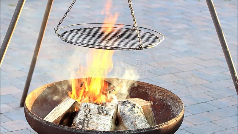 Bbq on hanging grill stock footage. Video of fire, pork - 87819794