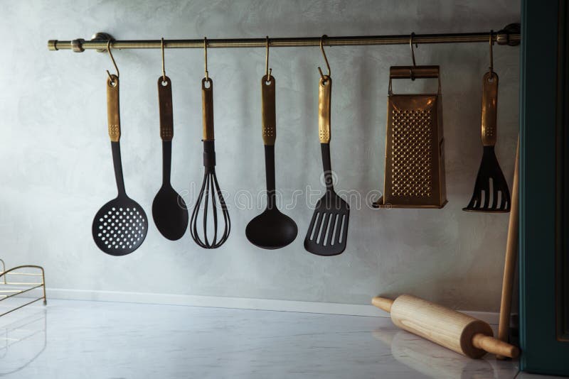 Hanging kitchen utensils stock image. Image of cooking - 121031989