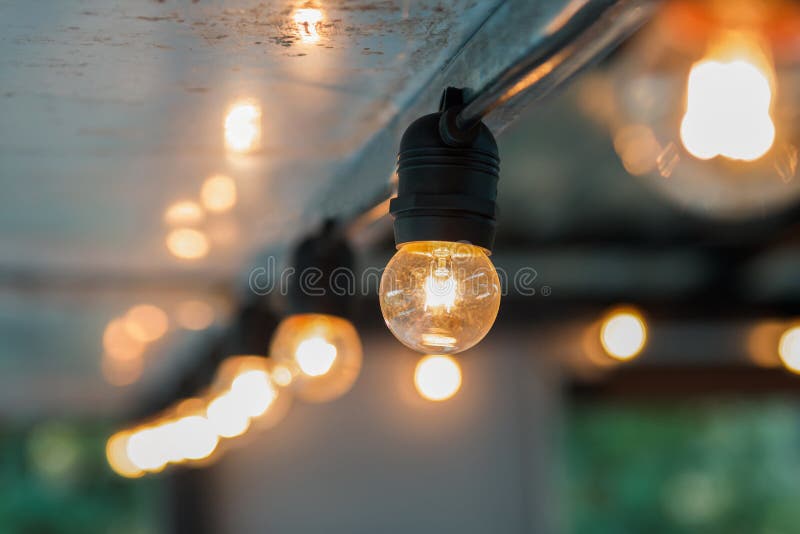 Hanging light bulb indoor stock photo. Image of shiny - 138365632
