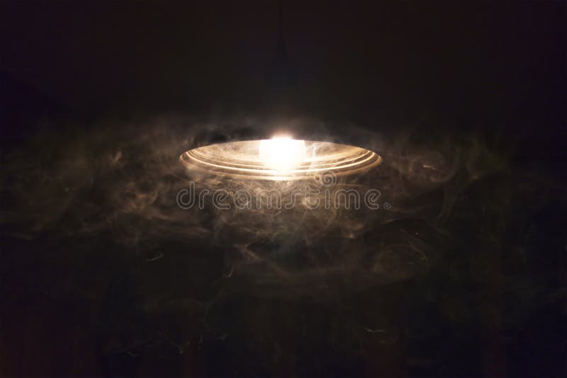 Hanging light with smoke stock image. Image of glow - 209720927