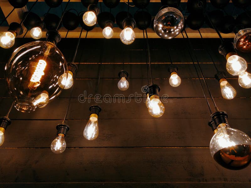 Hanging lightbulbs feature stock image. Image of darkness - 249585771