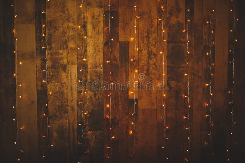 Lights Hanging Down from the Side of a Wall on a Dark Background Stock ...