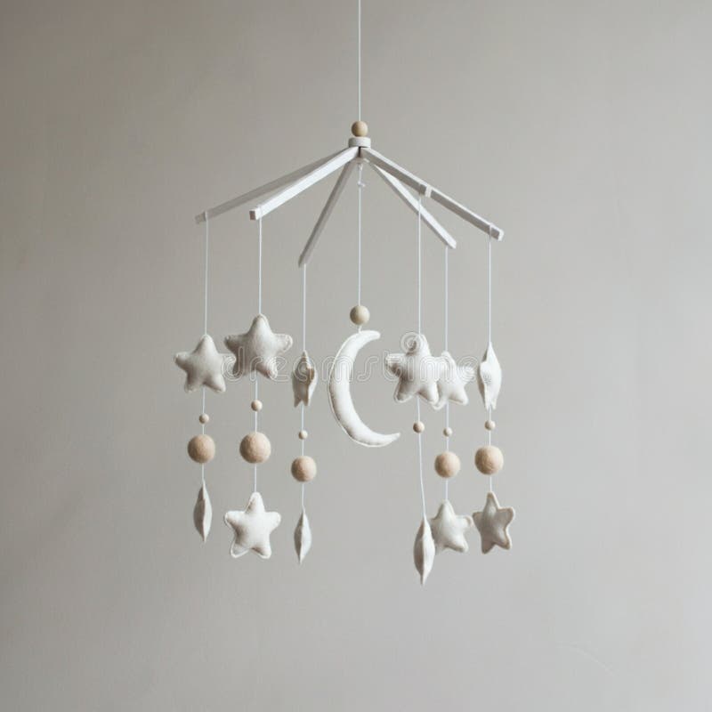 Hanging Mobile Features Plush Stars, a Crescent Moon, and Spherical ...