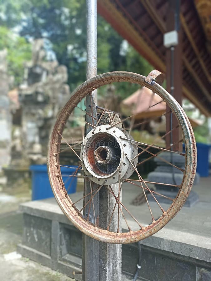 Hanging Old Vintage Rusty Wheels at the Temple Stock Photo - Image of ...