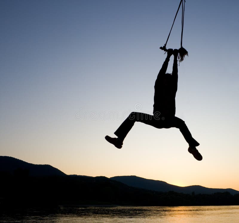 Hanging silhouette stock image. Image of prehensile, evening - 18333031