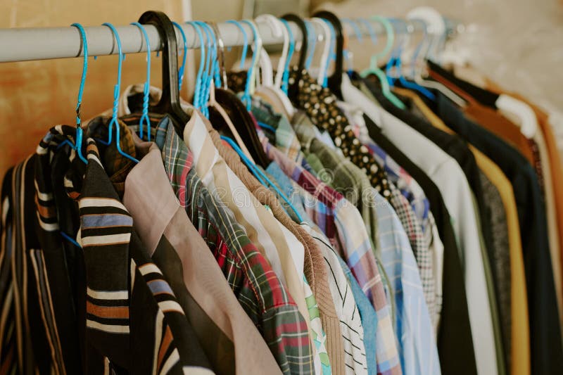 Hanging Various Shirts on Clothes Rack in Cozy Room Stock Image - Image ...