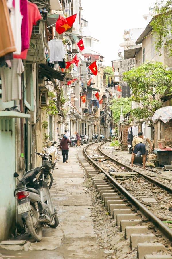 HANOI, VIETNAM - MAY 2014: Train Passing through Slums Editorial Image ...