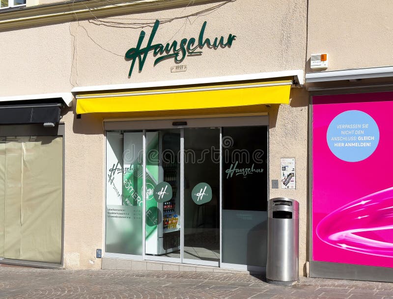 Hanselur Storefront with Bright Yellow Awning and Glass Doors Editorial ...
