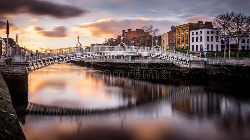Hapenny Bridge Over the Liffey River Long Exposure at Sunset Stock ...