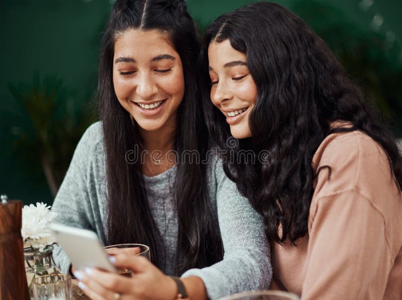 Happiness is Doubled when we Share it. Young Sisters Using a Smartphone ...