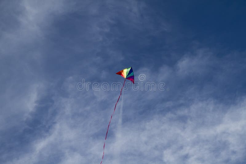 Happiness, Kite of Rainbow Colors on a Blue Sky with Light White Stock ...