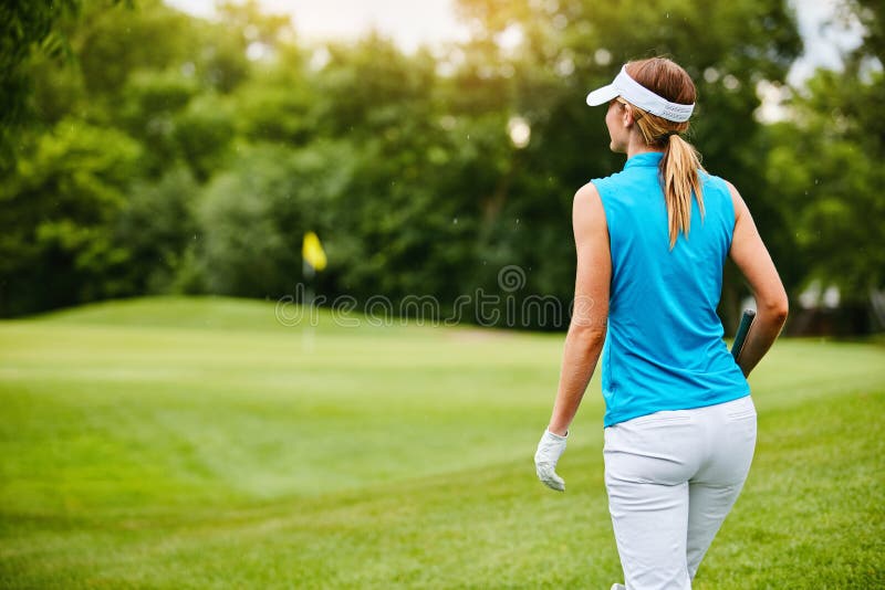 Happiness is a Long Walk with the Putter. a Woman on a Golf Course ...