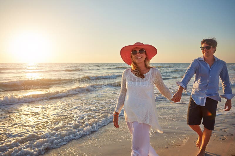 Happiness is a Romantic Stroll on the Beach. a Happy Couple Walking on ...