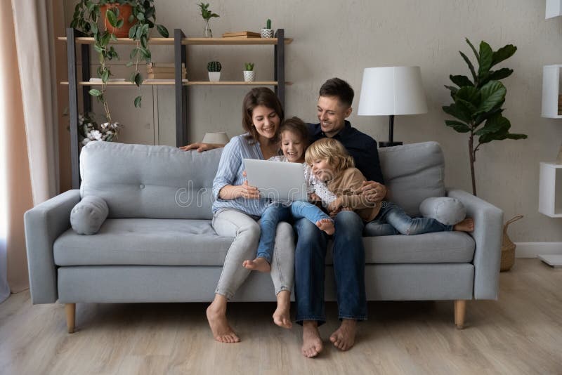 Happy Affectionate Family Using Computer Applications. Stock Photo ...