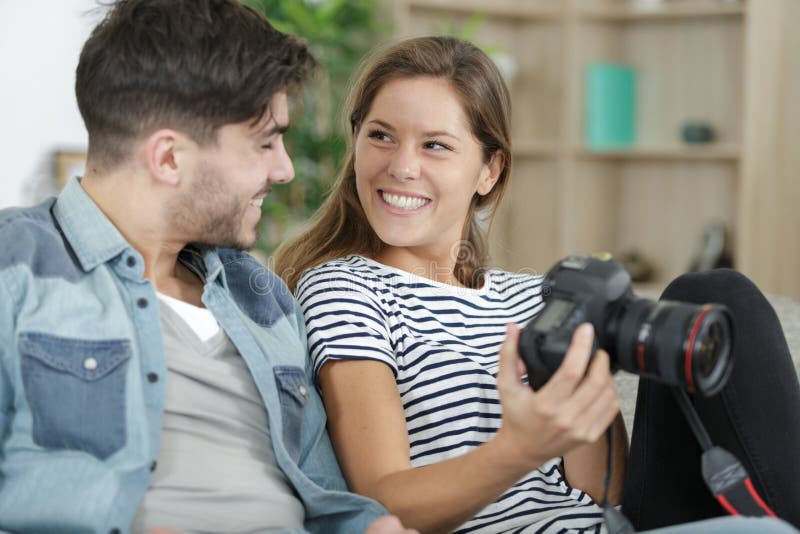 Happy Affectionate Young Couple Checking Photos Stock Image - Image of ...