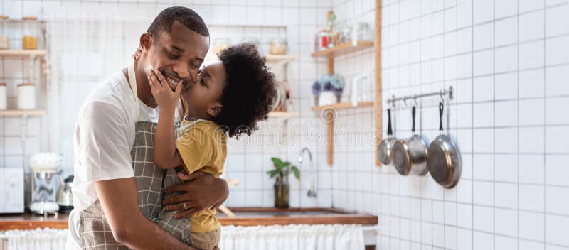 Happy African American Father And His Son At Kitchen Loving Black