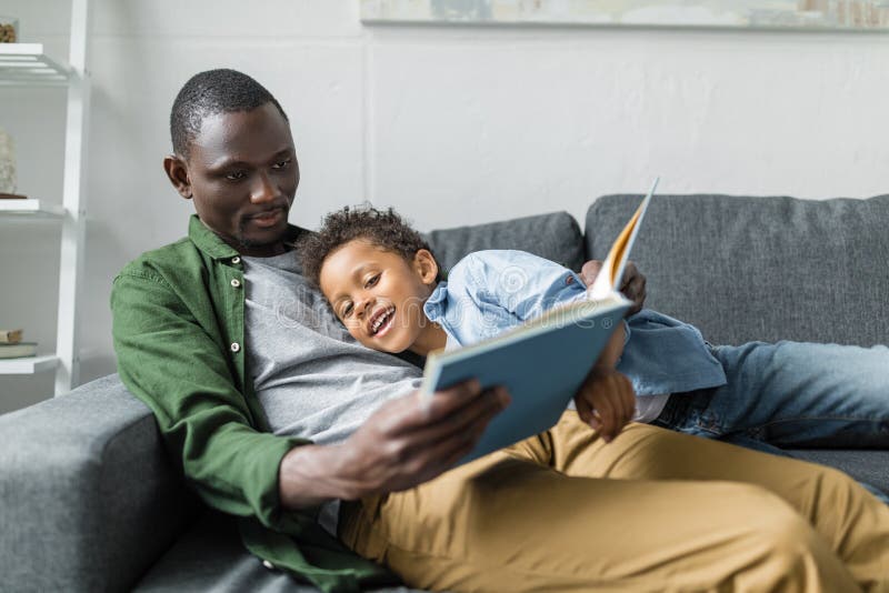 Happy African American Father And Son Reading Stock Image Image Of