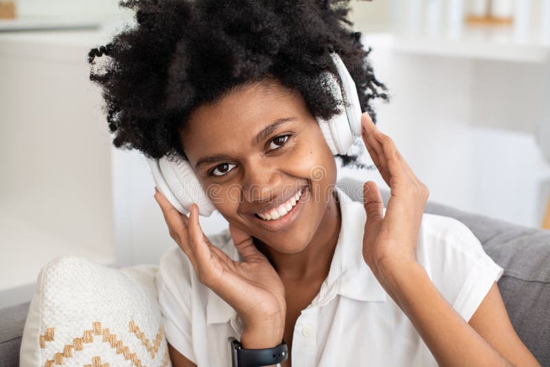 Happy African American Woman In Headphones Looking At Camera Stock
