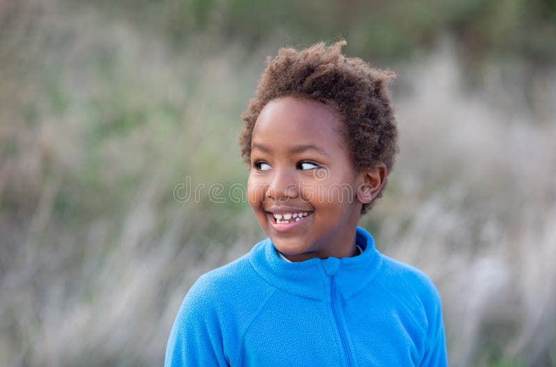 Happy African Child with Blue Jersey Stock Image - Image of relaxed ...