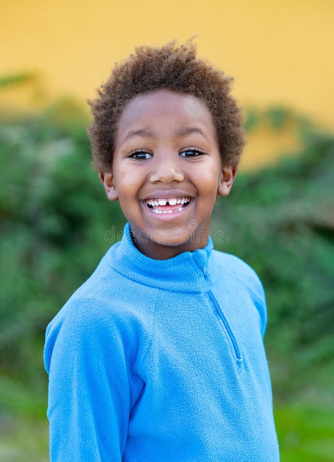 Happy African Child with Blue Jersey Stock Image - Image of elementary ...