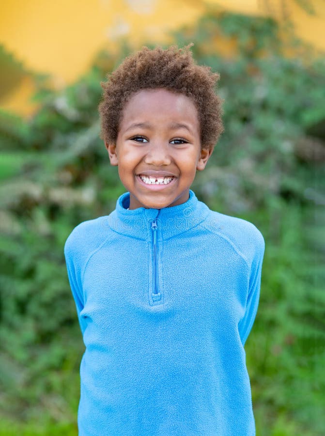 Happy African Child with Blue Jersey Stock Image - Image of people ...