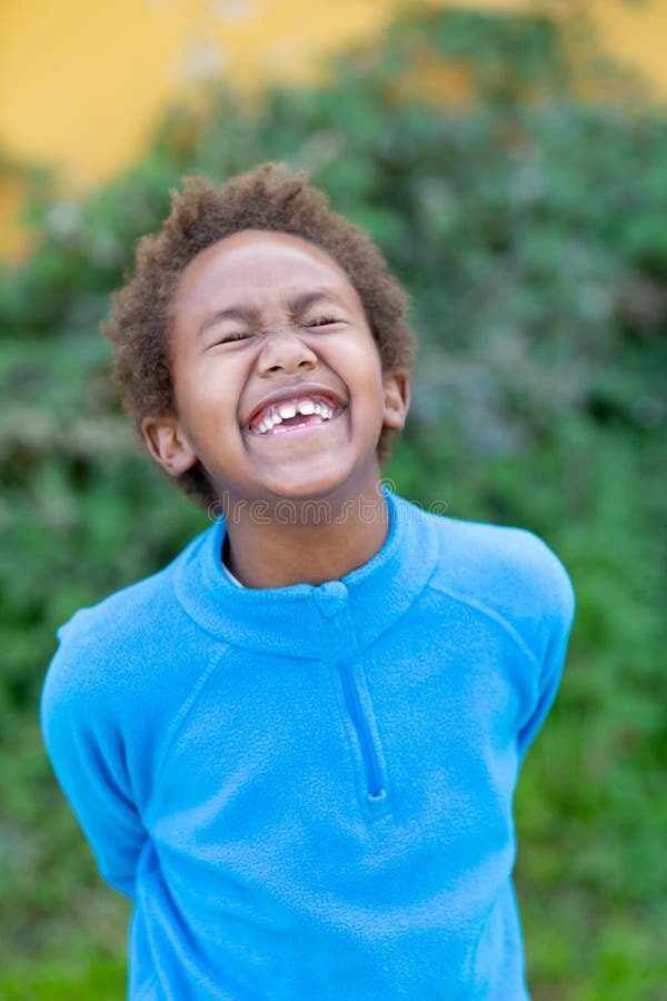 Happy African Child with Blue Jersey Stock Photo - Image of childhood ...
