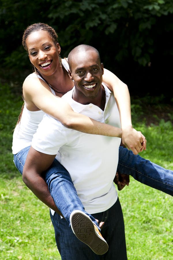 Happy African couple stock photo. Image of shirts, park - 14594554