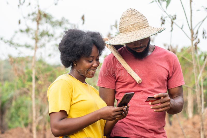 African Farmers Using a Phone and Credit Card Stock Image - Image of ...