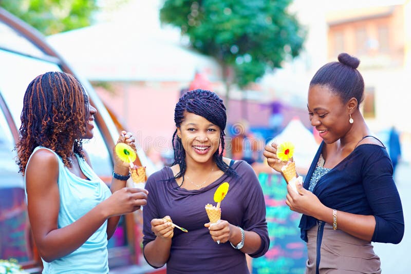 Happy African Friends Eating Ice Cream Outdoors Stock Image - Image of ...