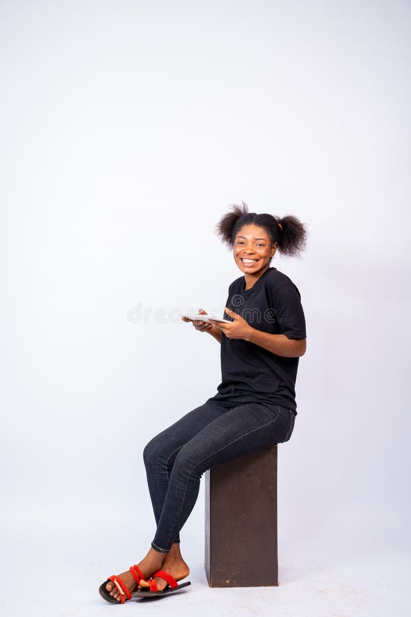 Close Up of an Excited African Lady Holding a Tablet Computer with the ...