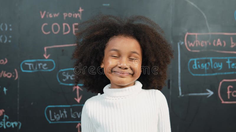 African Girl Smiling while Standing at Board with Code or Prompt ...
