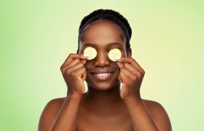 Happy African Woman Making Eye Mask Of Cucumbers Stock Image Image Of