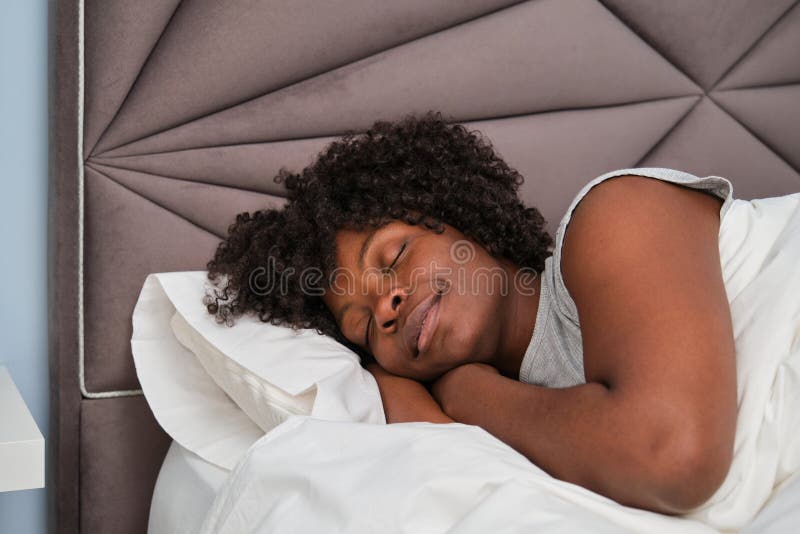 Happy African Young Woman Sleeping on White Sheets in Bed. Stock Photo ...