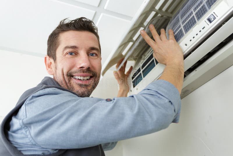 Happy Air-con Maintenance Man Stock Photo - Image of expertise, fixing ...