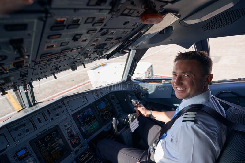 Happy Airplane Pilot Smiling To Camera with Hand on Wheel Stock Photo ...