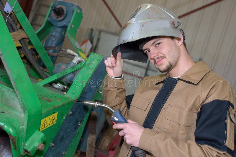 Happy Apprentice Welder at Work in Plant Stock Photo - Image of ...